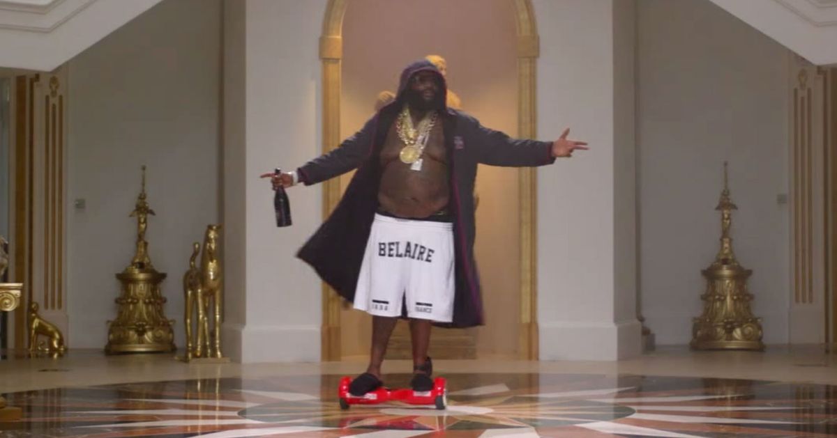 Watch a Shirtless Rick Ross Spin Around on a Hoverboard With His Ankle ...