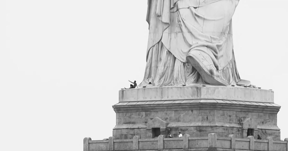 Woman Climbs Statue of Liberty Over Trump Immigration Policy
