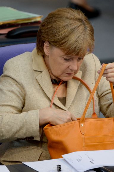 Angela Merkel Loves Rummaging Through Her Enormous Handbag