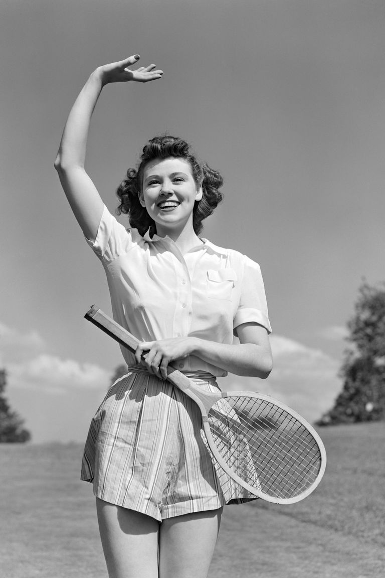 Ladies Looking Glamorous Posing With Tennis Racquets