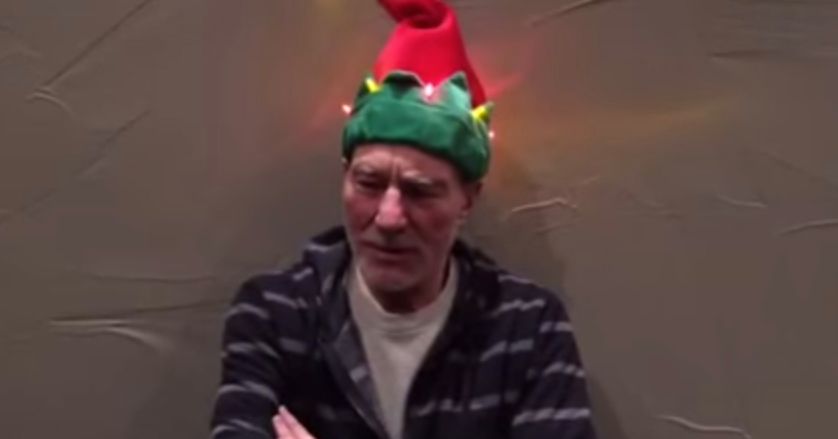 Even Patrick Stewart Can’t Not Laugh at the Singing Santa Hat on His Head