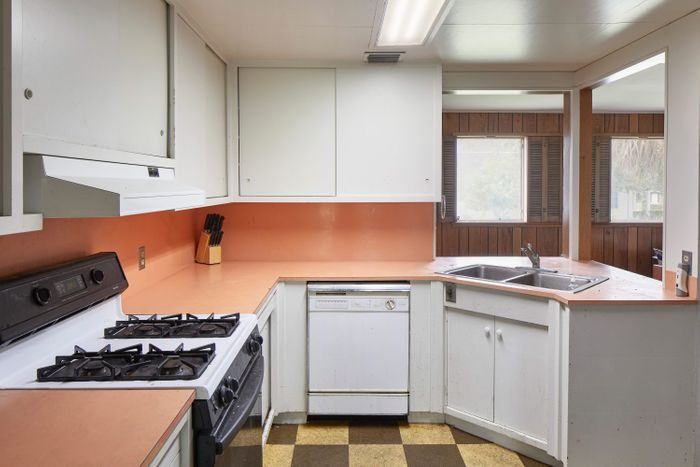 Mid-Century Home Comes With Peachy Formica Countertops