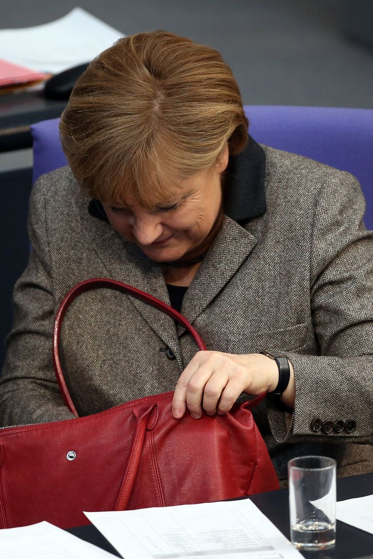 Angela Merkel Loves Rummaging Through Her Enormous Handbag