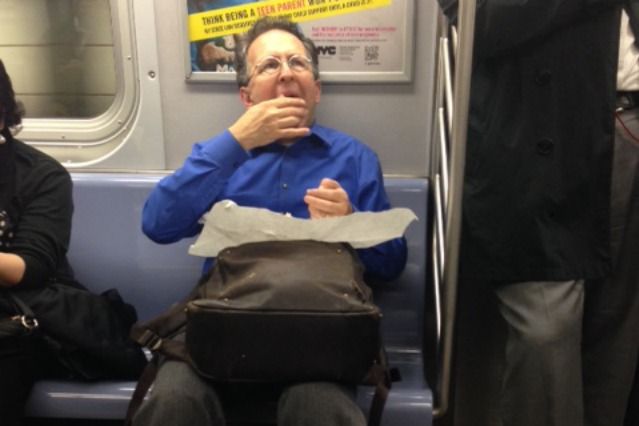 Otherwise Respectable Man Devours Massive Piece of Brie on Subway