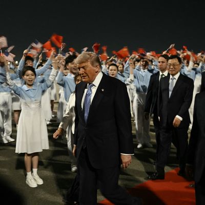 Trump Lands in China, Gets Red Carpet, Chanting Young People