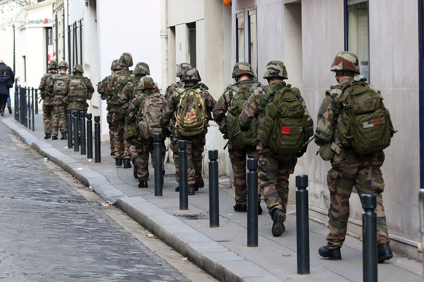 Suspected Planner of Paris Attacks Killed in Police Raid