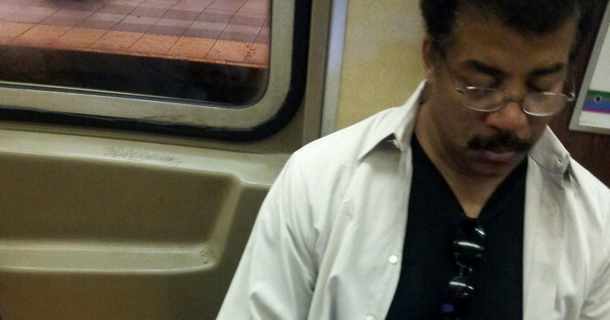 Neil deGrasse Tyson Uses His Laptop on the Subway