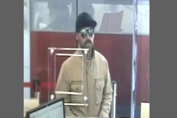 Stylish Bank Robber Apparently Spending a Lot of That Stolen Cash on ...