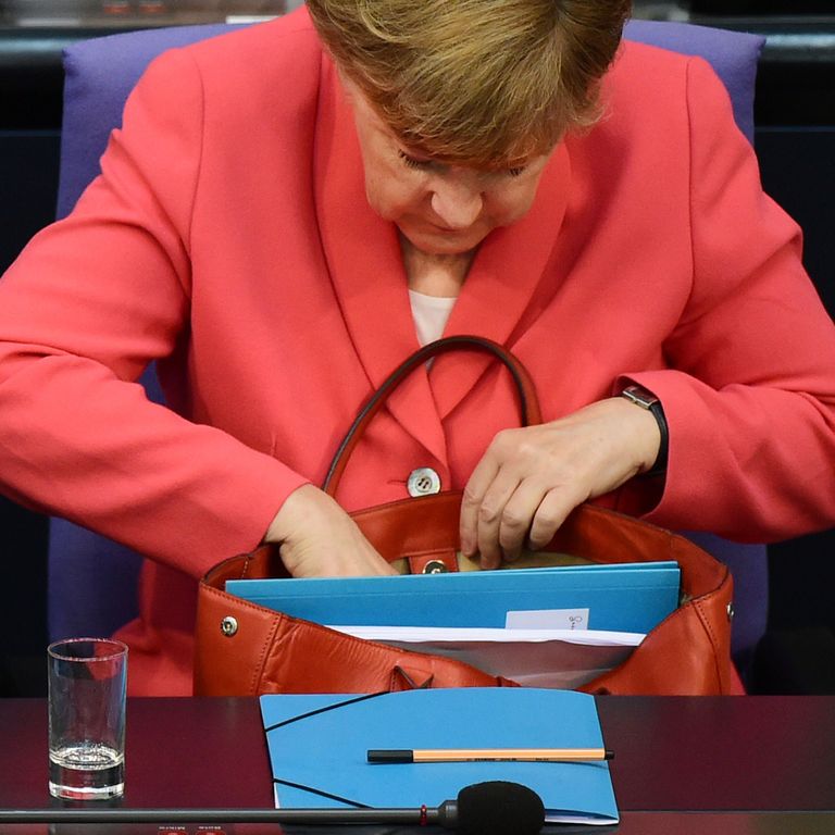 Angela Merkel Loves Rummaging Through Her Enormous Handbag