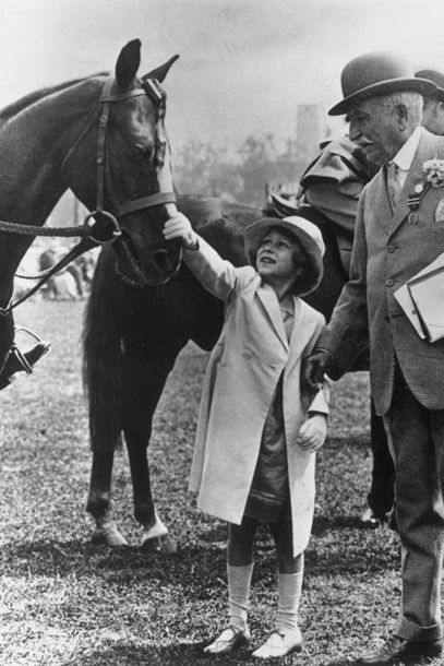 See Queen Elizabeth With Corgis, a Panda, Elephants, and Other Animals