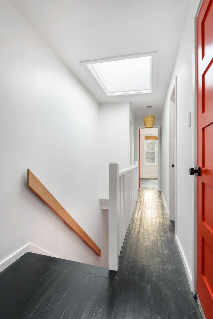 A Customized Glendale House With a Bright-Red Staircase