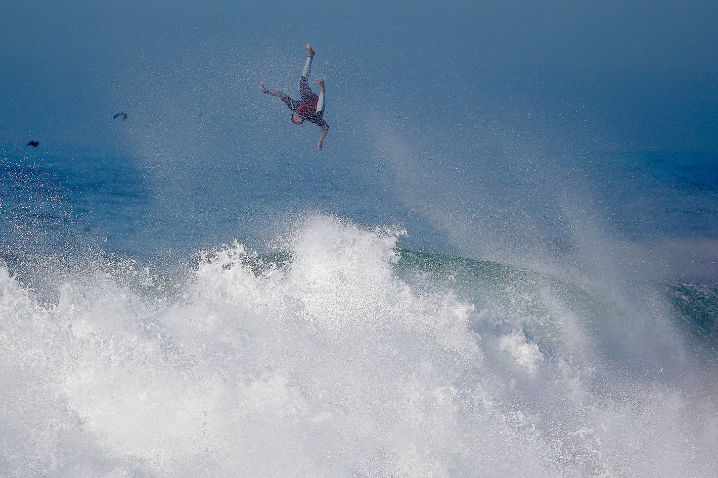 Surfers Tackle 20-Foot Waves While You Sit Inside Reading This